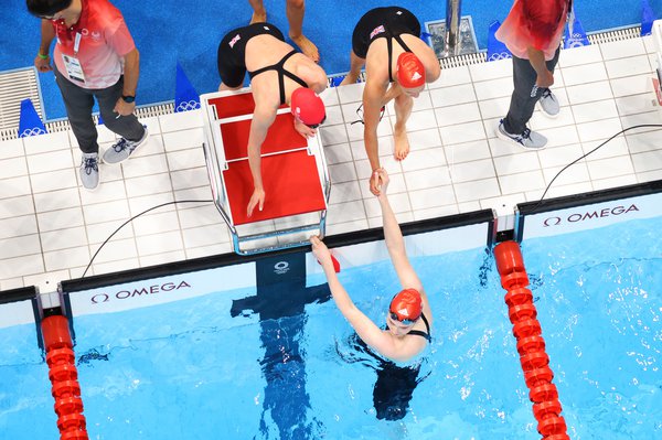 British quartet break relay record, as Olympic swimming action gets ...