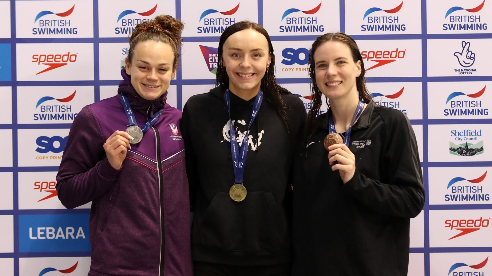 Harris and Morgan clinch close victories in backstroke battles ...